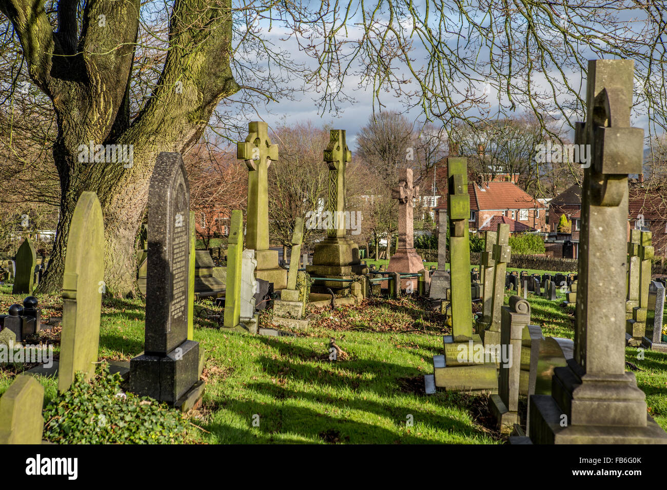 Gravestones in Standish parish church graveyard in winter on a sunny ...