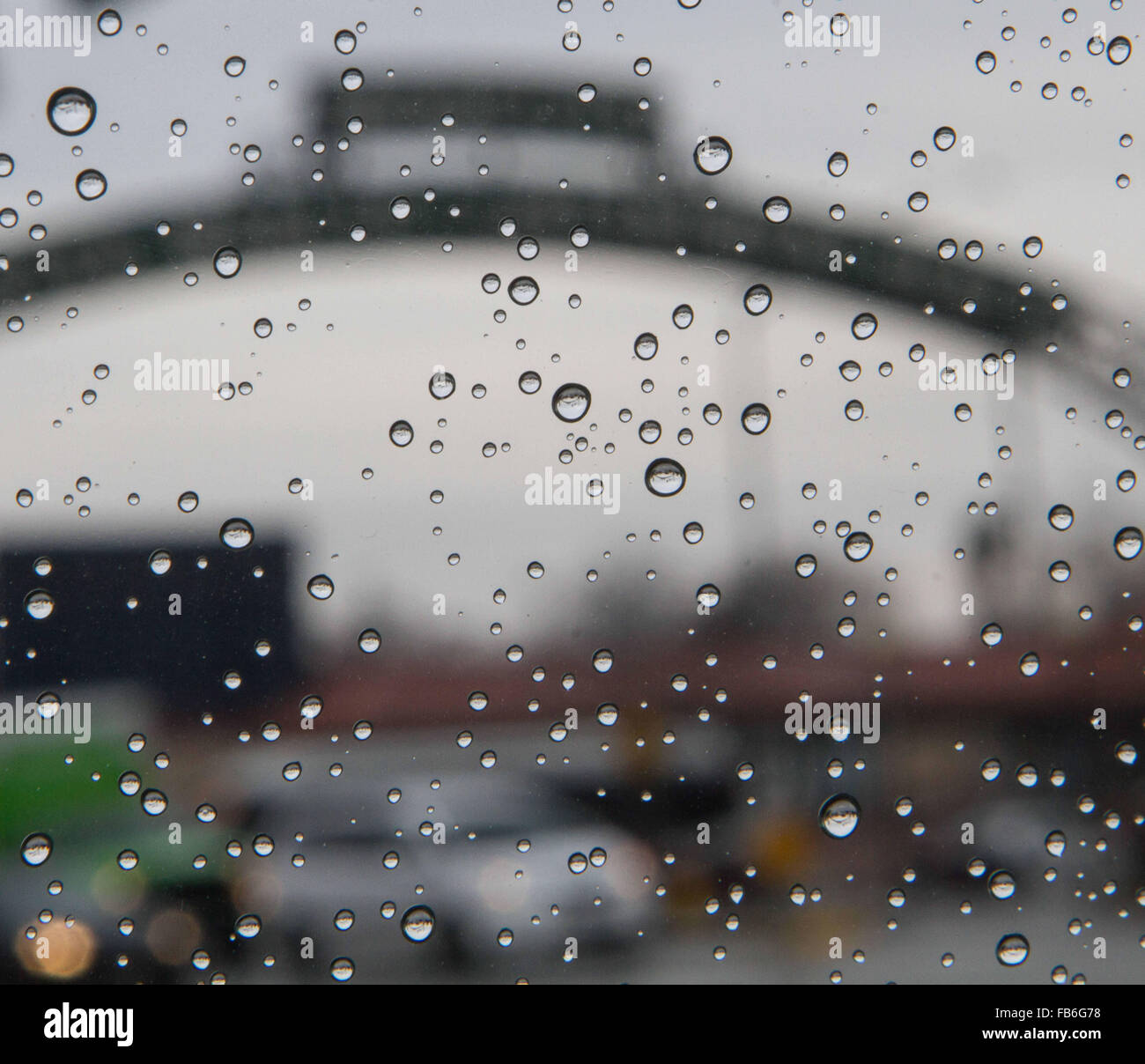 Modesto, CA, USA. 11th Jan, 2016. Rain drops cover a window during a ...