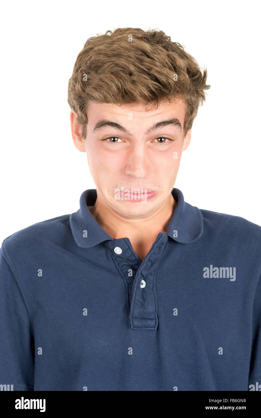 Disgusted teenage boy making faces isolated in white Stock Photo - Alamy