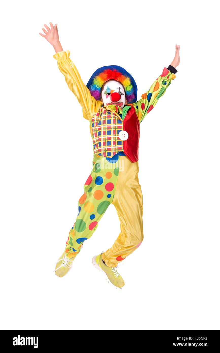 Young girl with clown costume jumping isolated in white Stock Photo - Alamy