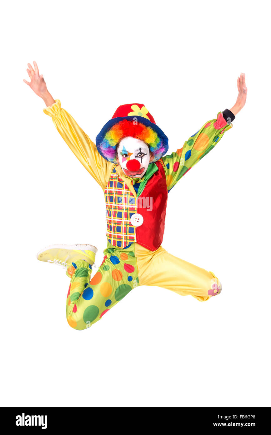 Young girl with clown costume jumping isolated in white Stock Photo - Alamy