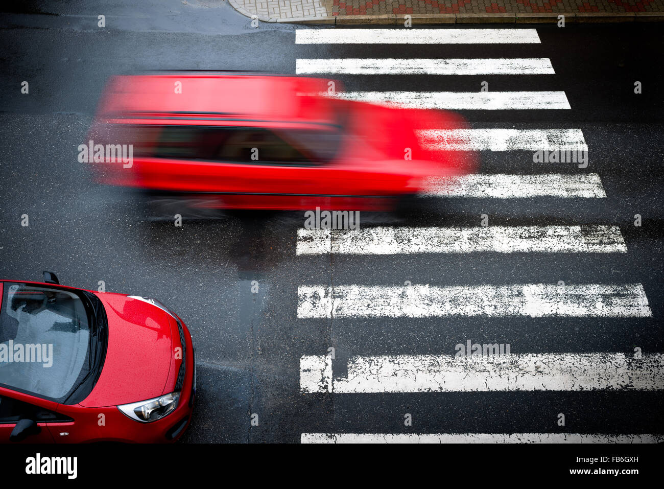 two red cars on the pedestrian crossing Stock Photo - Alamy