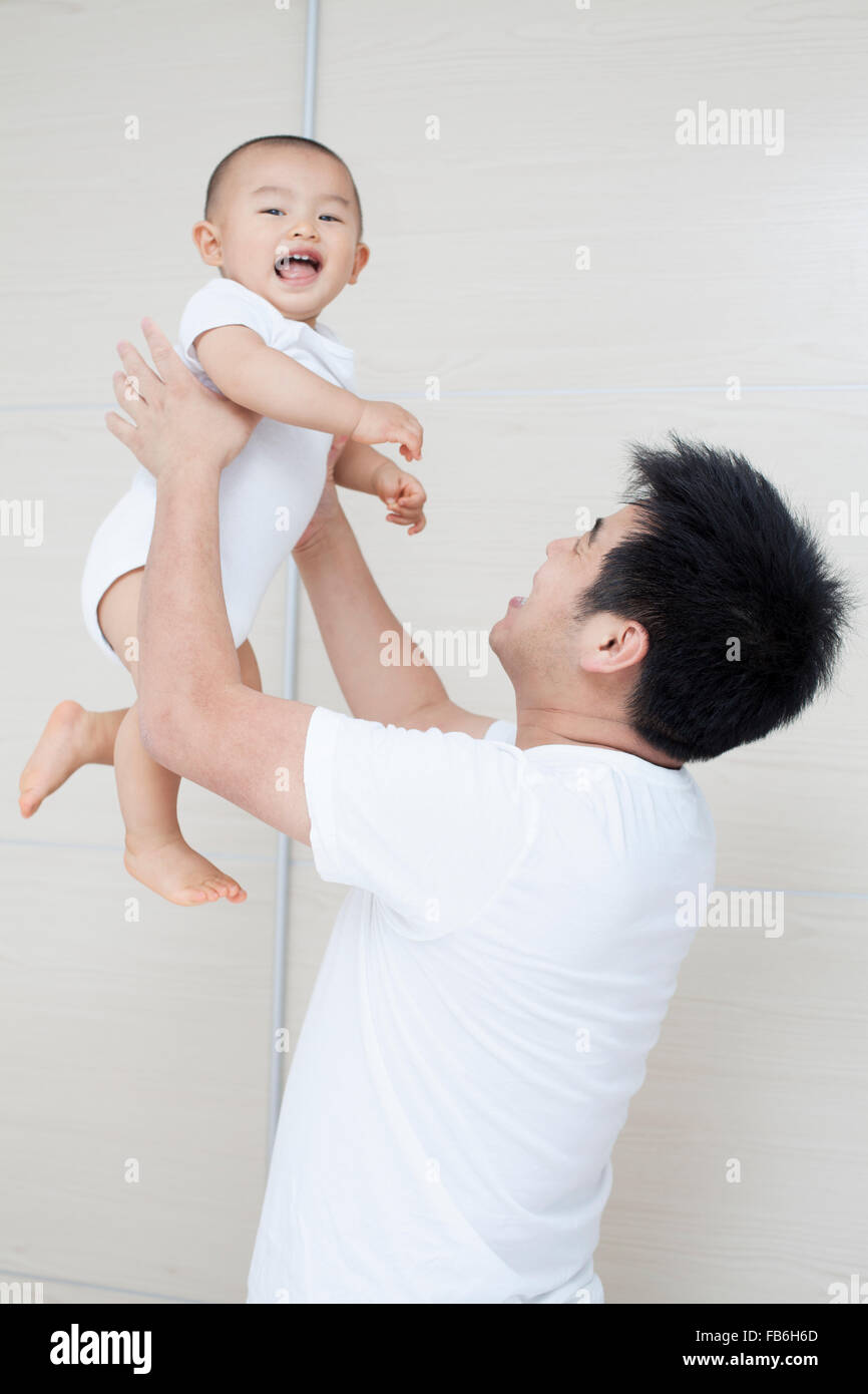 Tender moment between Chinese father and son, real people Stock Photo ...