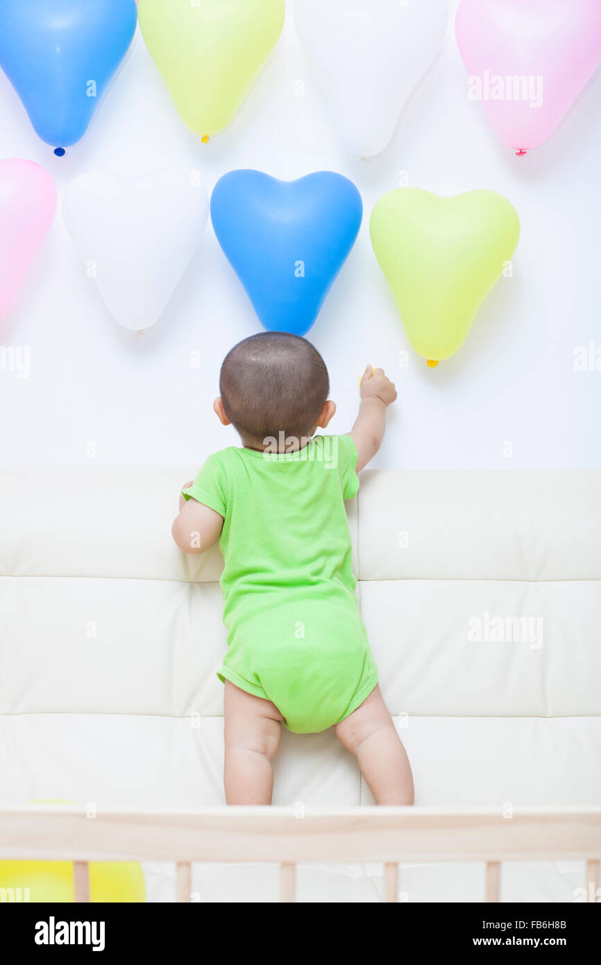 Chinese baby boy and colorful balloons, shot in Beijing, China Stock ...