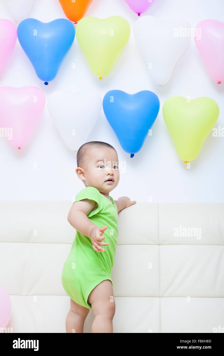 Chinese baby boy and colorful balloons, shot in Beijing, China Stock ...