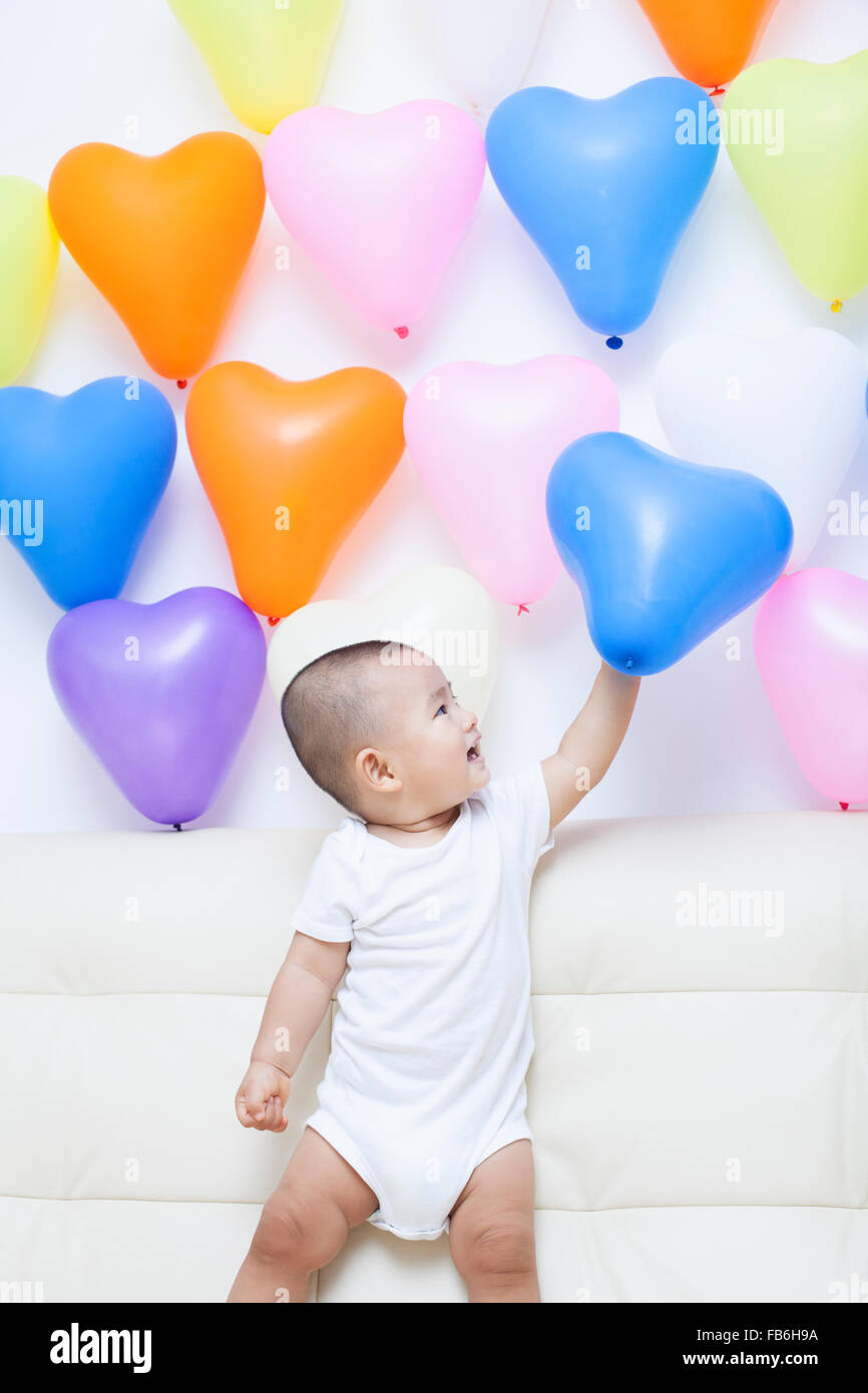Chinese baby boy and colorful balloons, shot in Beijing, China Stock ...