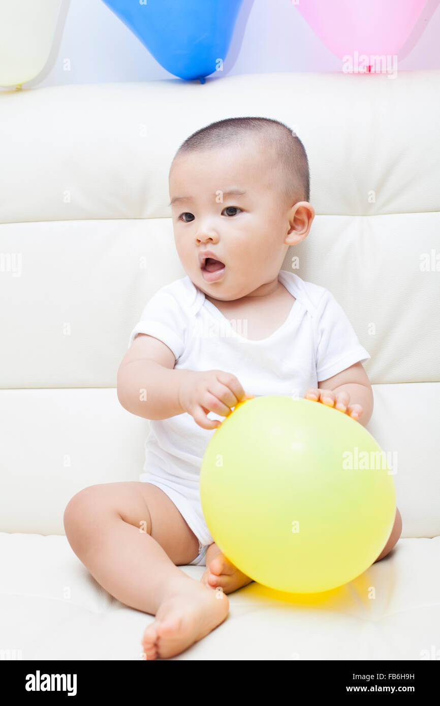 Chinese baby boy and colorful balloons, shot in Beijing, China Stock ...