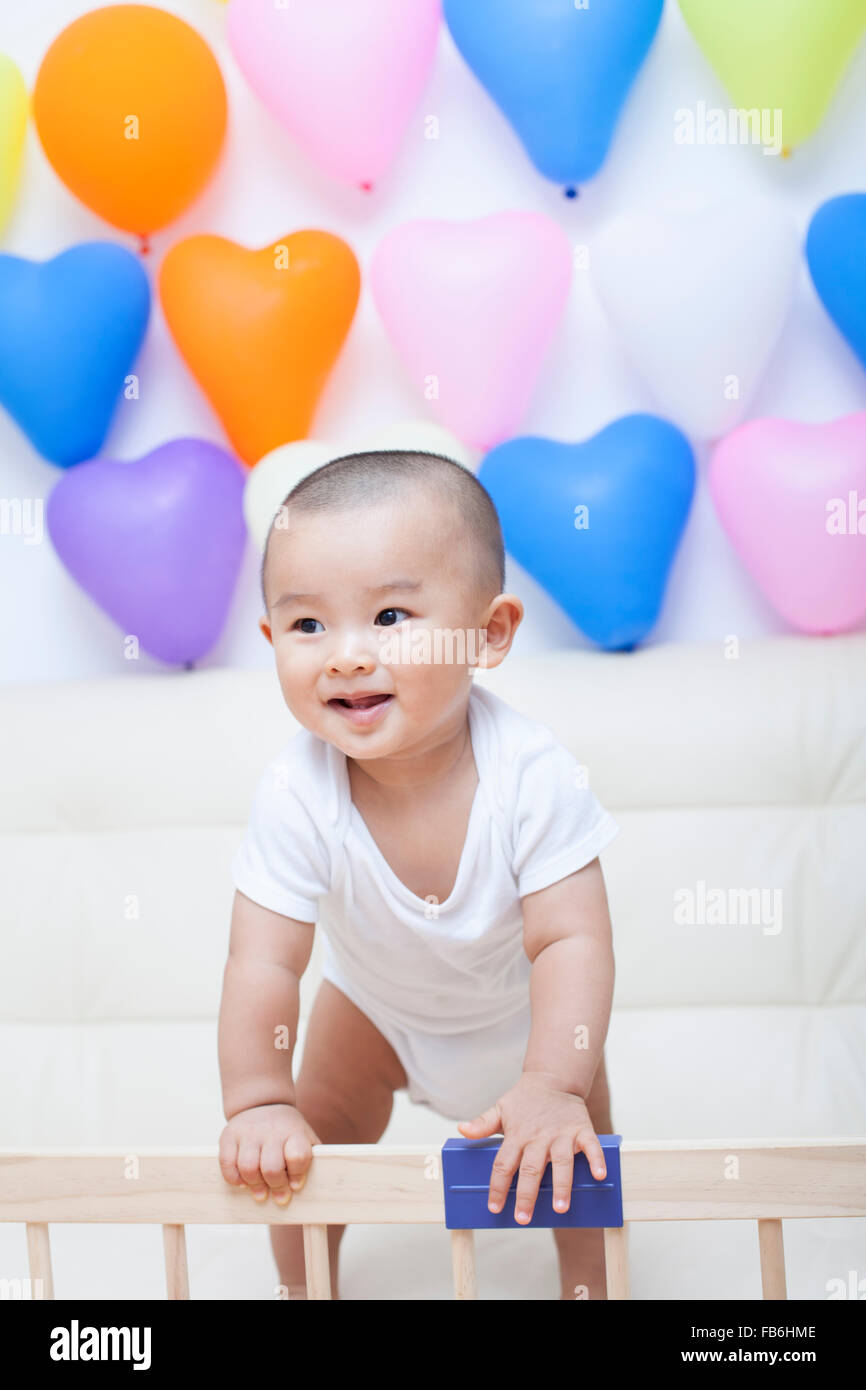 Chinese baby boy and colorful balloons, shot in Beijing, China Stock ...
