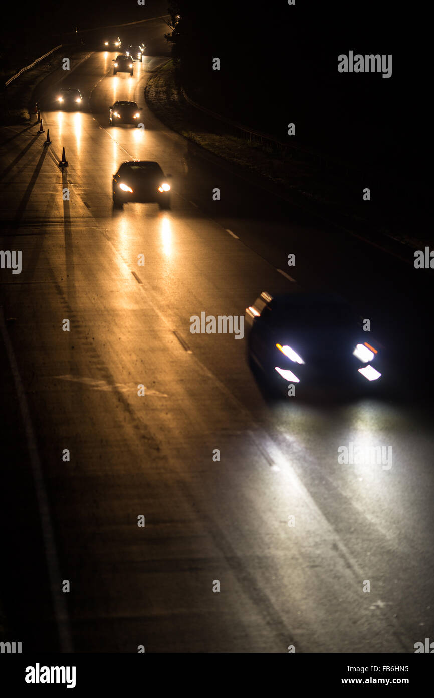 Busy highway at night with cars of commuters going home from work Stock ...