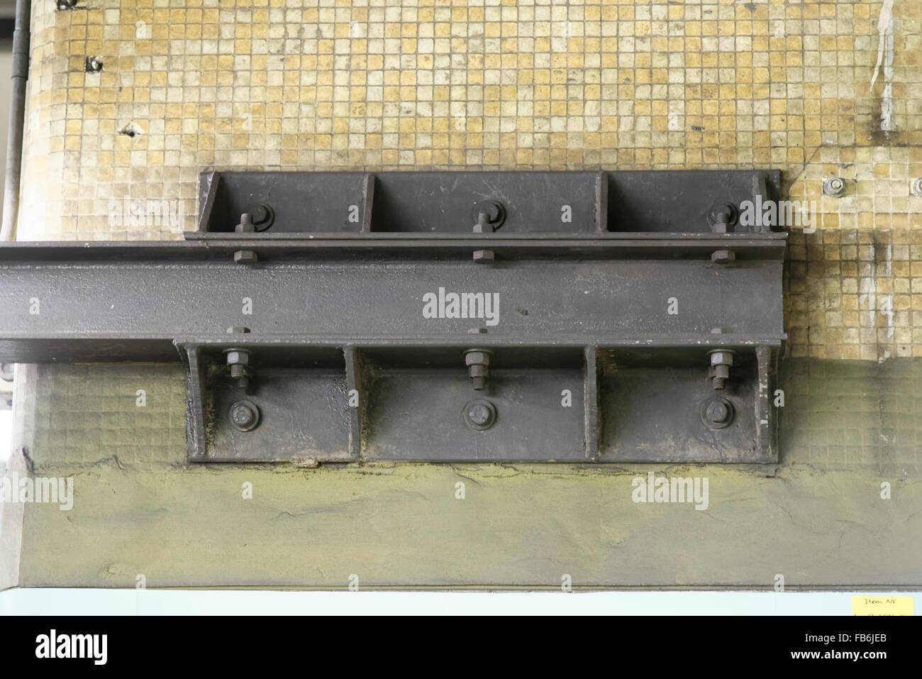 metal beam with screws connected to a wall Stock Photo - Alamy