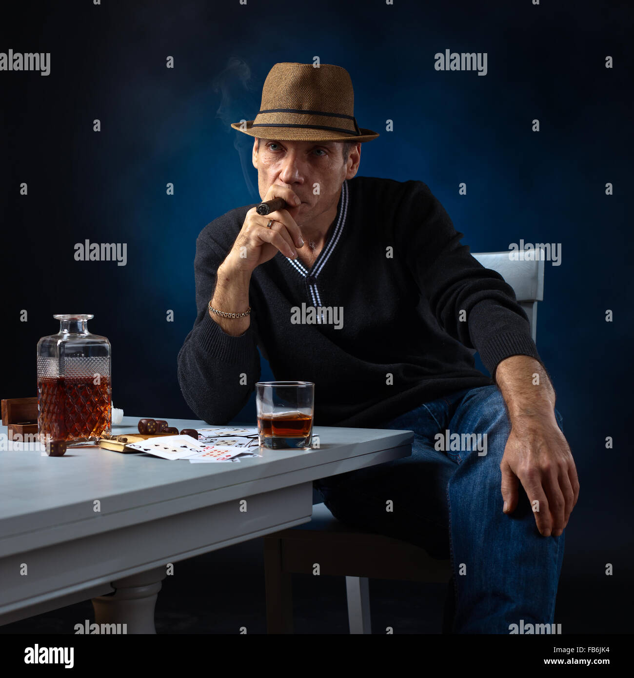 player with whiskey and cigar, studio shot Stock Photo - Alamy
