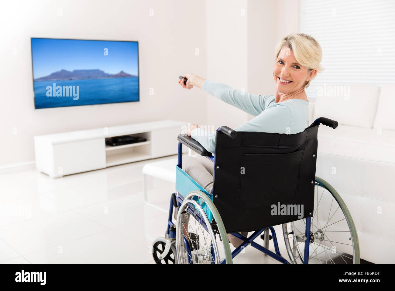Old woman watching tv wheelchair hi-res stock photography and images ...