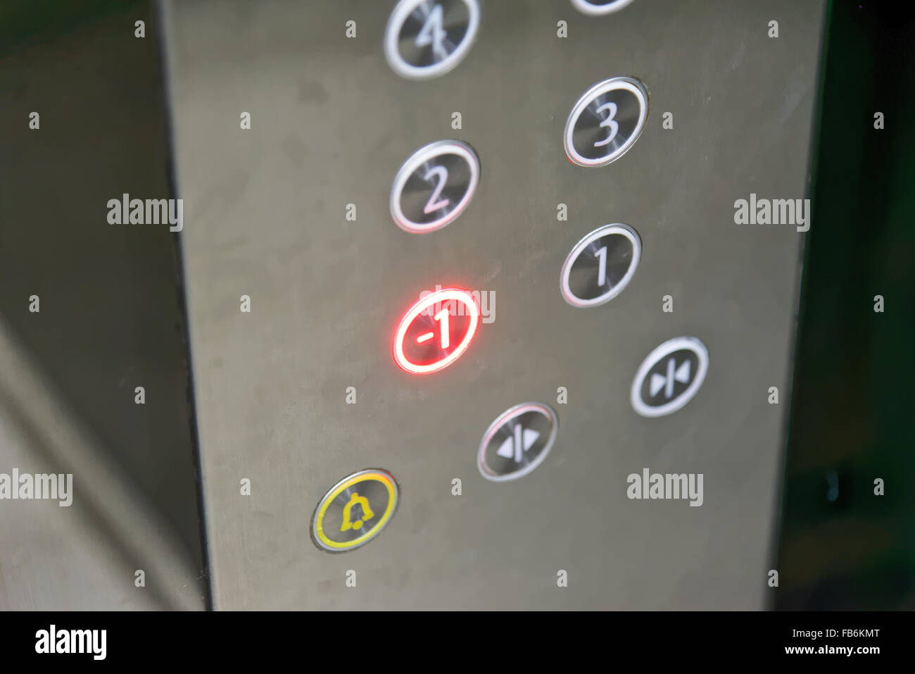 -1 floor button lighten on elevator panel Stock Photo - Alamy