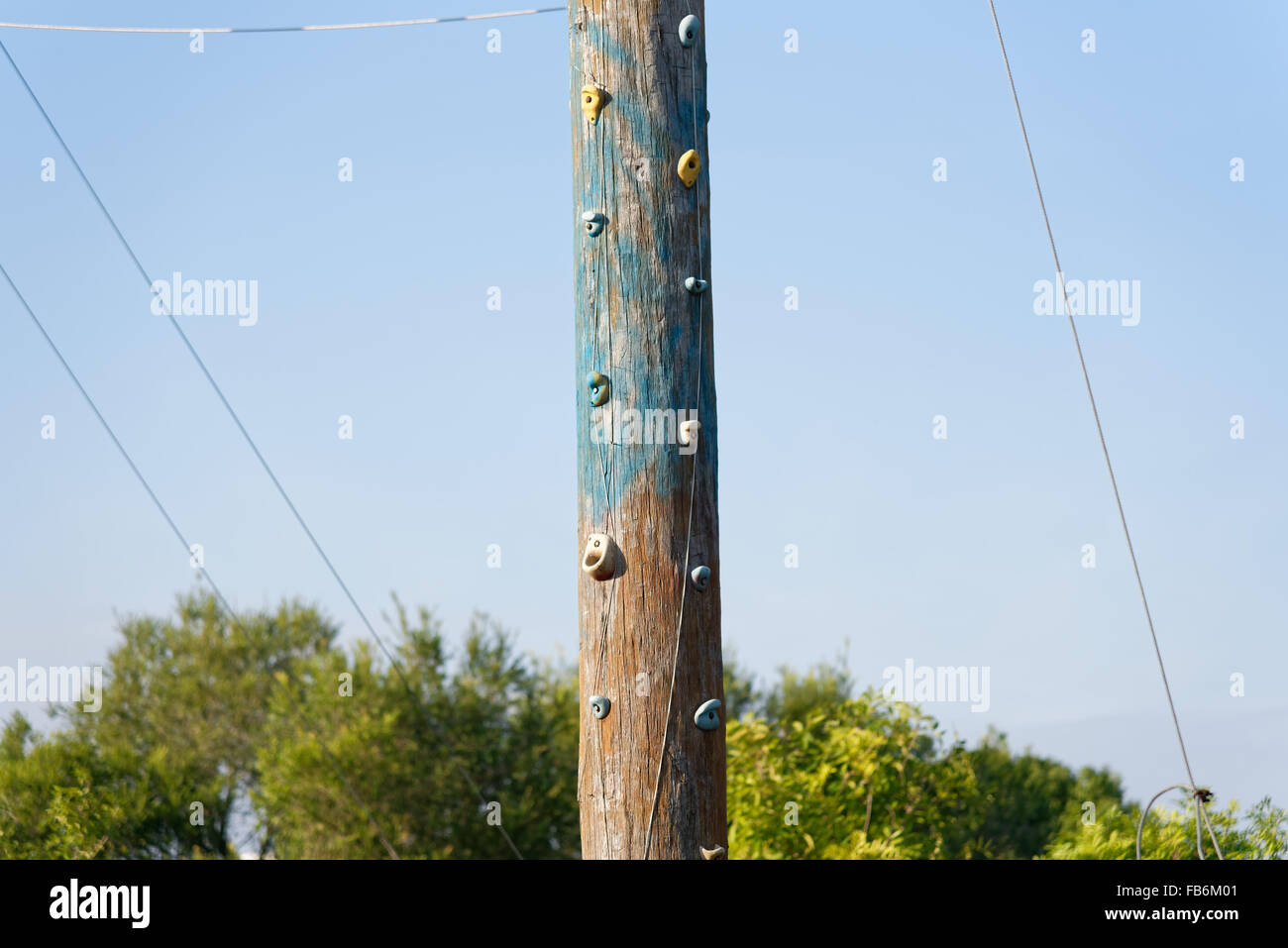 wooden pillar with climbing steps on it Stock Photo - Alamy