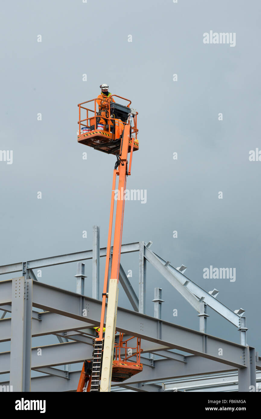 Men working in elevated work platforms hi-res stock photography and ...