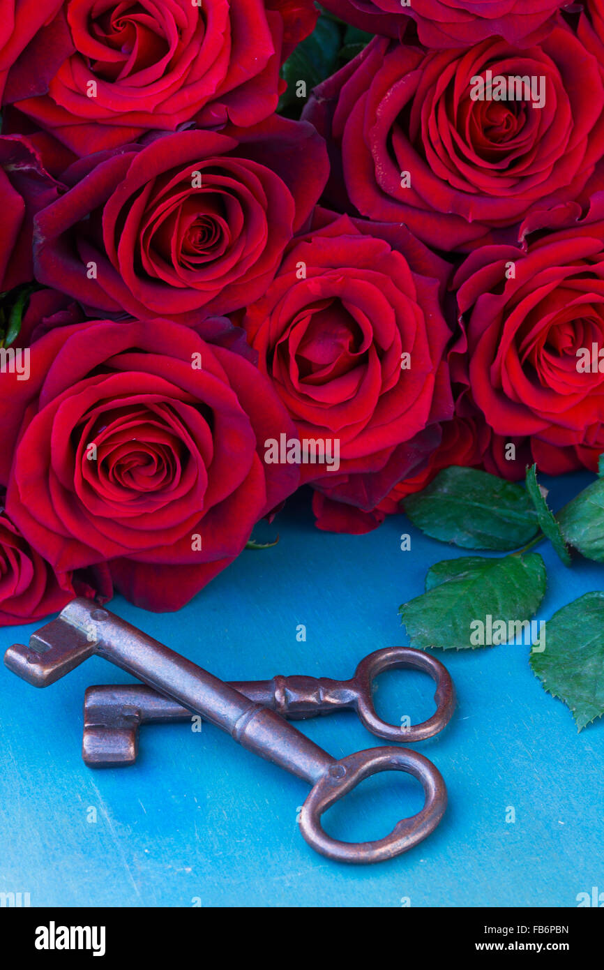 red roses with two keys Stock Photo - Alamy