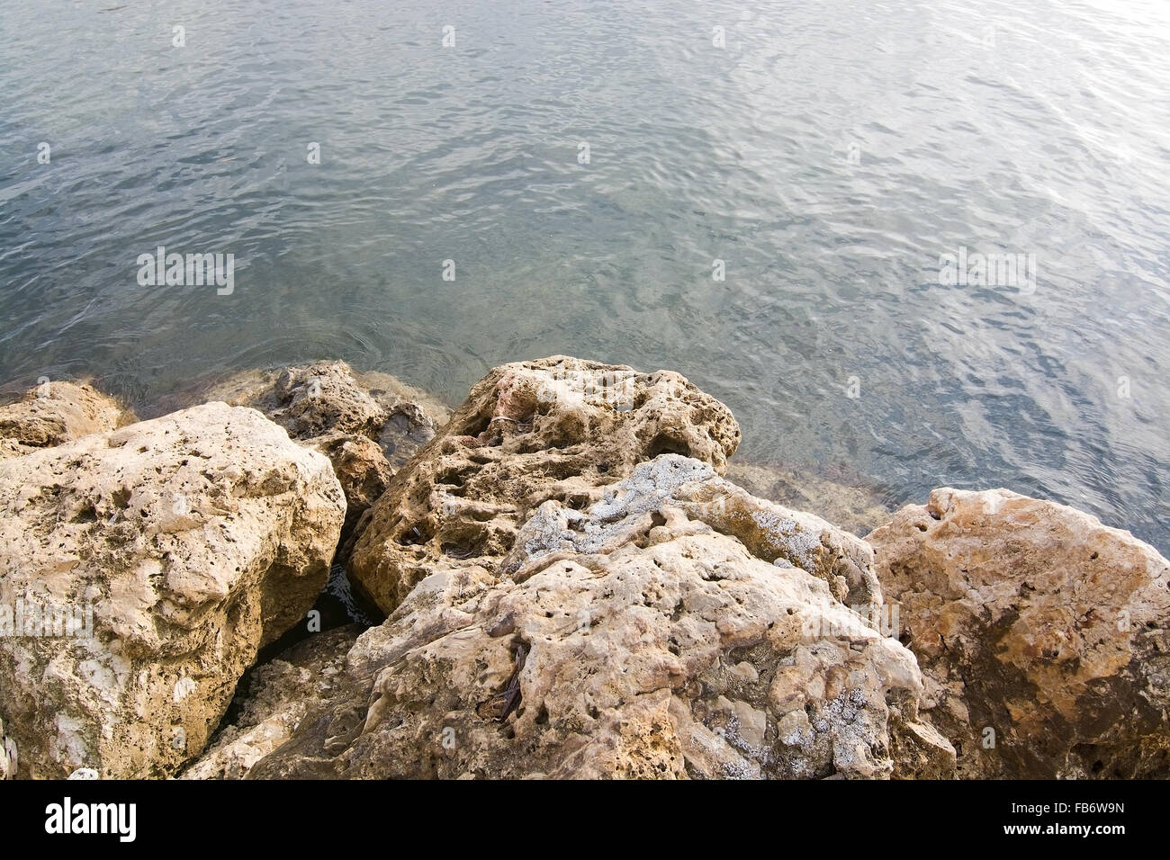 Rocks and sea background in Balearic islands, Spain Stock Photo - Alamy