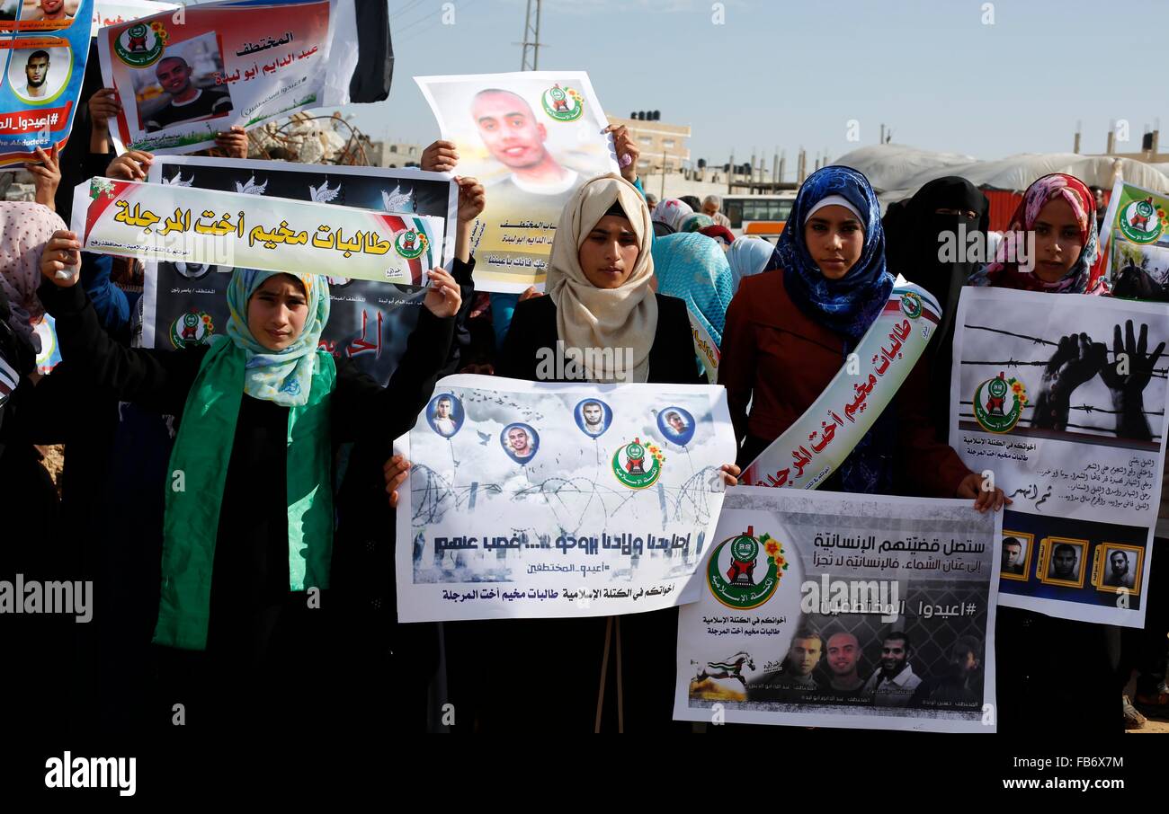 Gaza, Palestine. 11th Jan, 2016. People hold banners and placards as ...