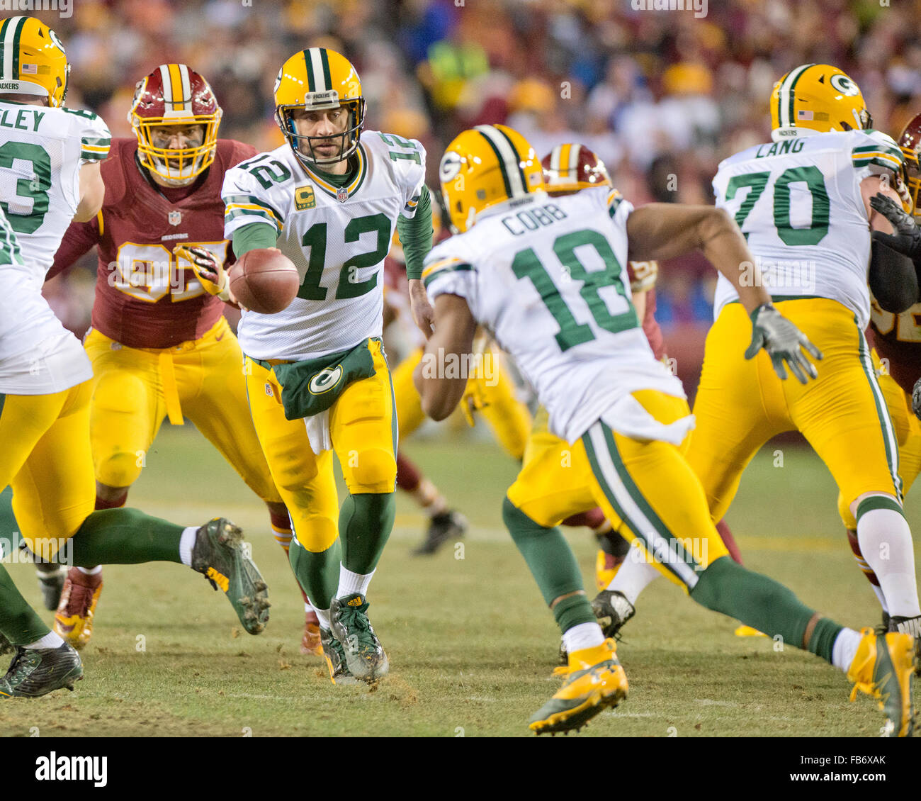 Green Bay Packers quarterback Aaron Rodgers (12) hands off to Green ...