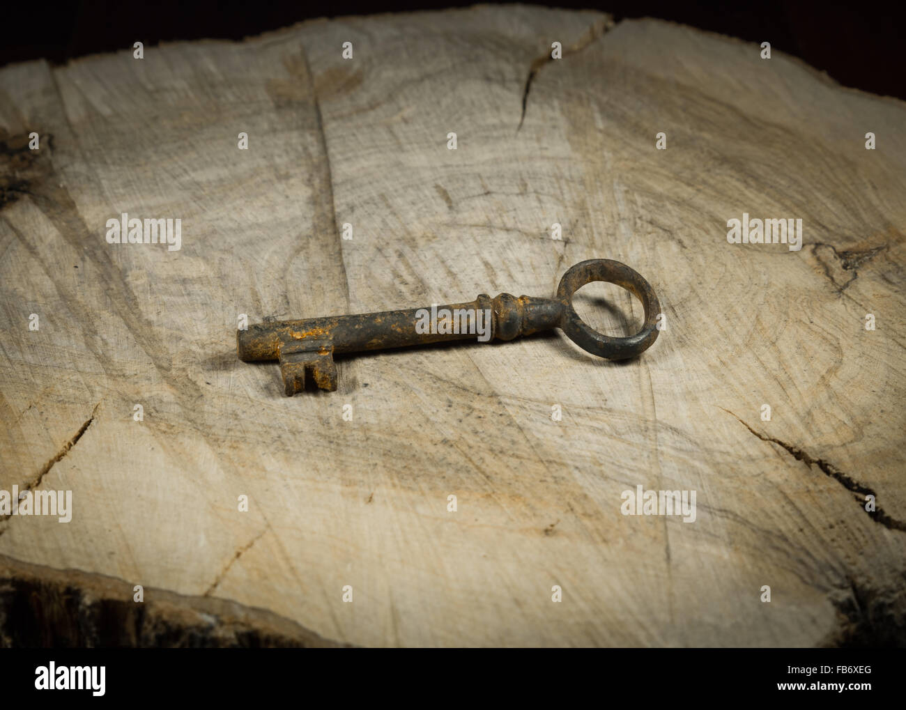 Old rusty key on wood Stock Photo - Alamy