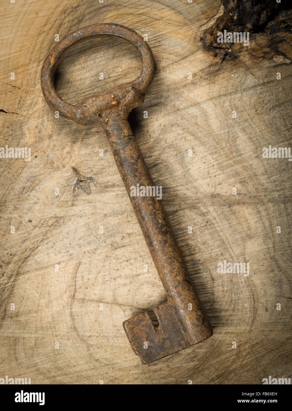 Old rusty key on wood Stock Photo - Alamy