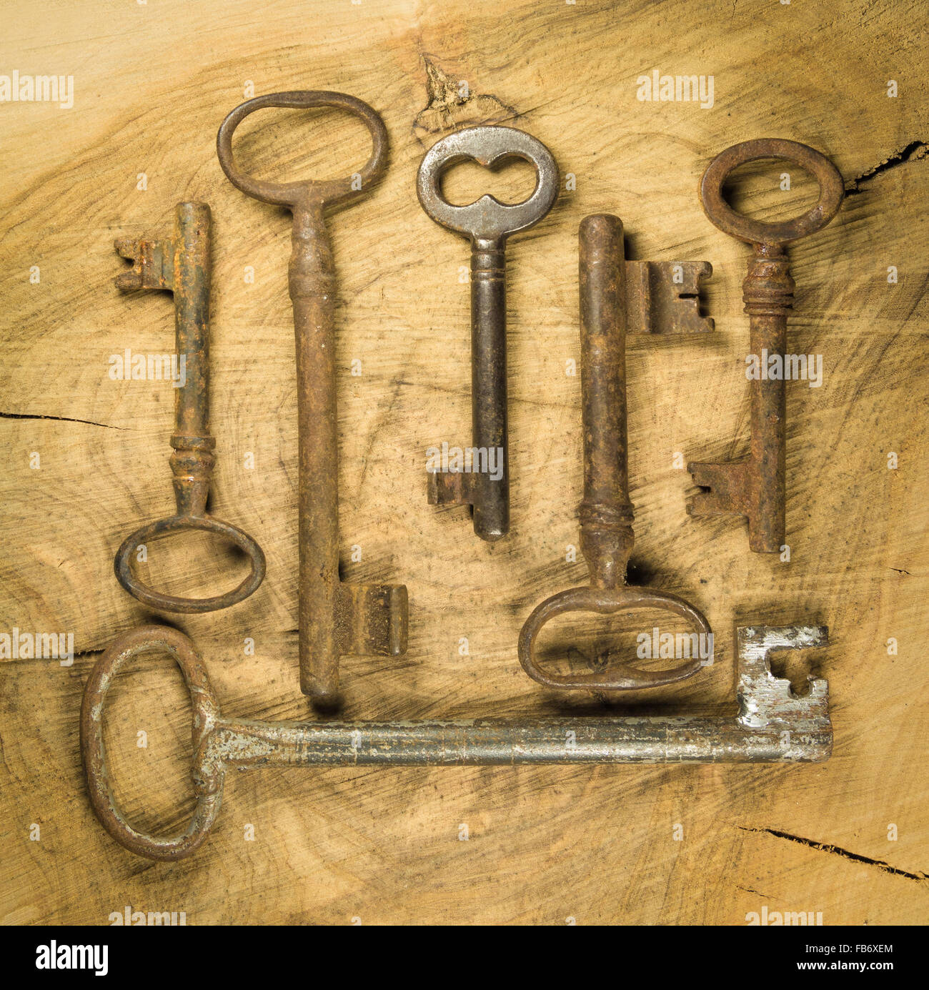 Group of old rusty keys on wood Stock Photo - Alamy