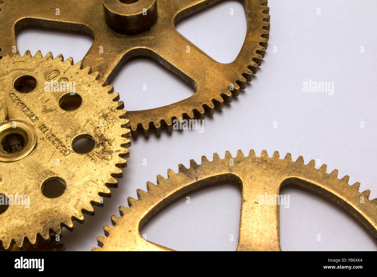 Brass Cogs on White Background Stock Photo - Alamy