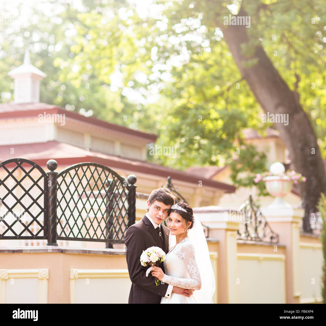 Bride and groom having a romantic moment on their wedding day Stock ...