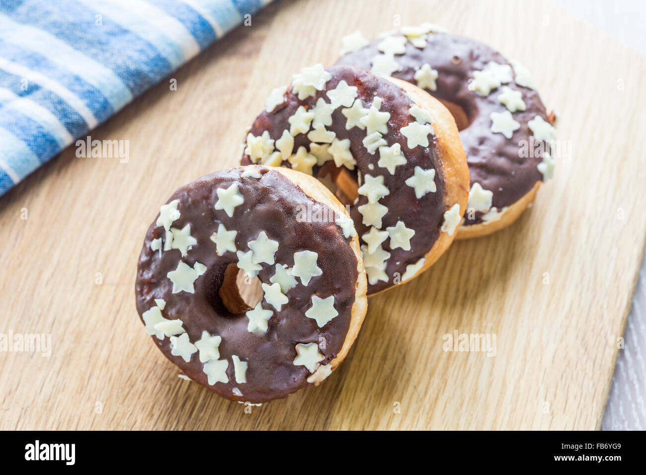2 Chocolate Star covered ring Doughnuts Stock Photo - Alamy