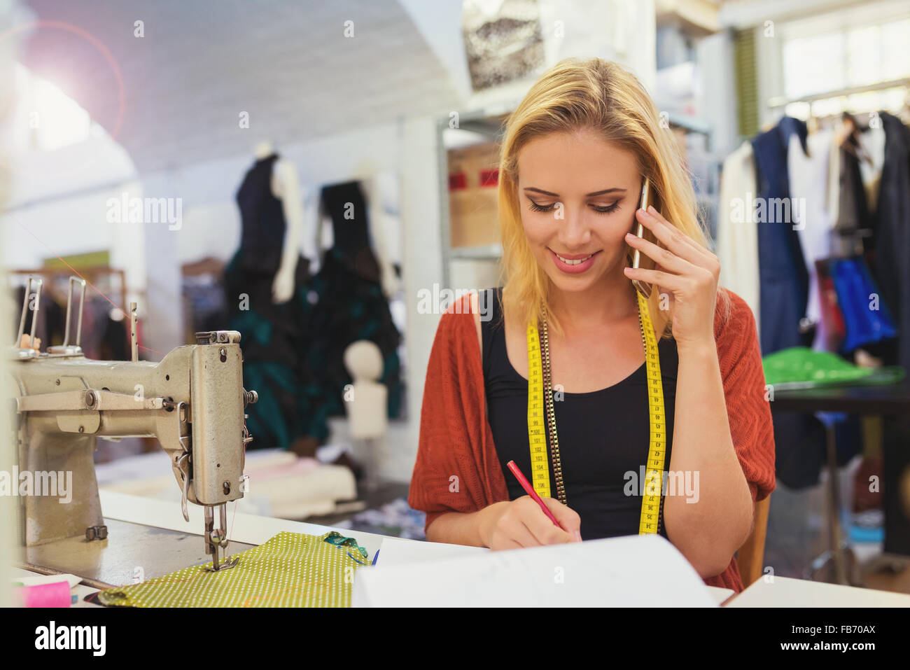 Young tailor woman Stock Photo - Alamy