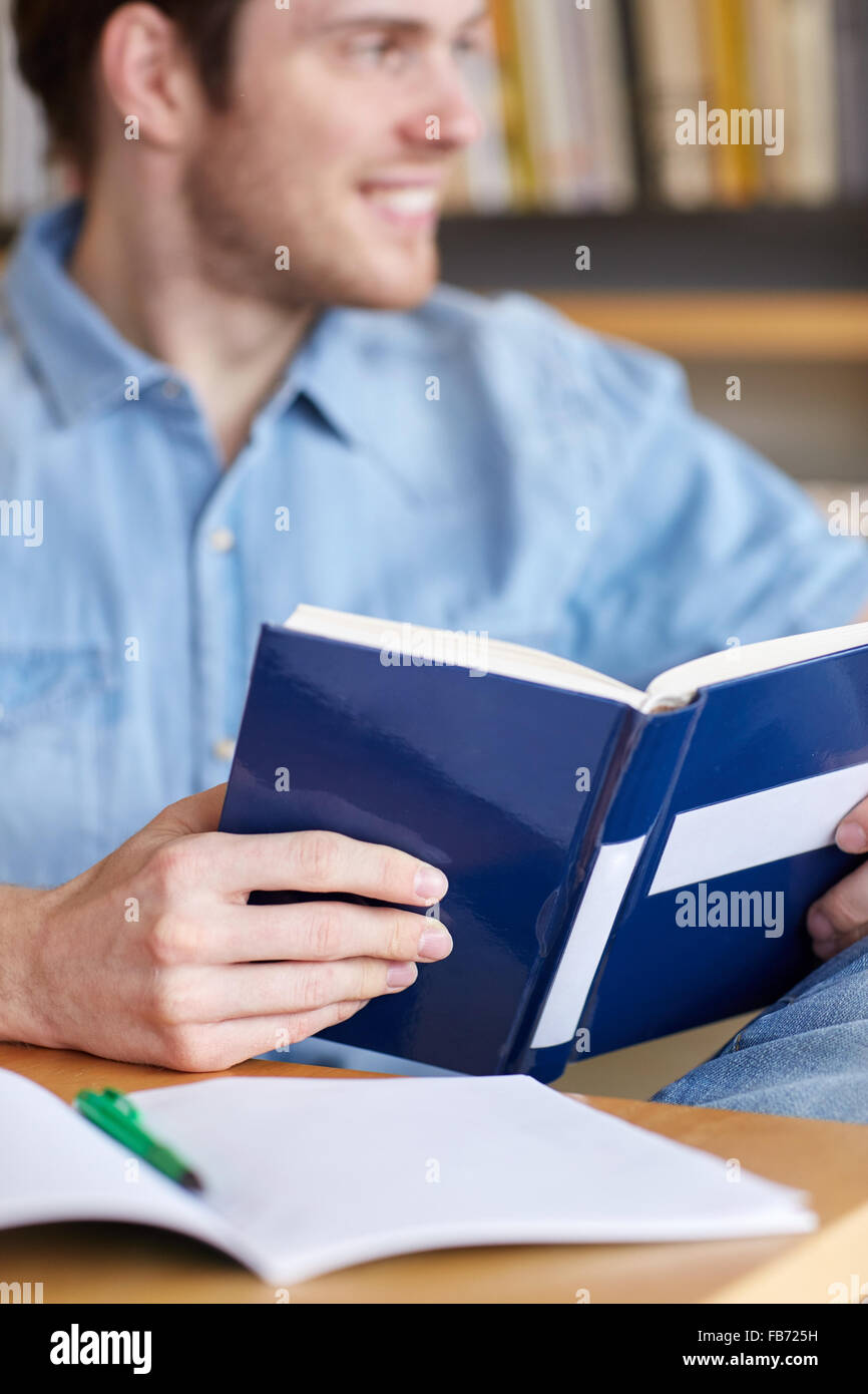 close up of student reading book at school Stock Photo - Alamy