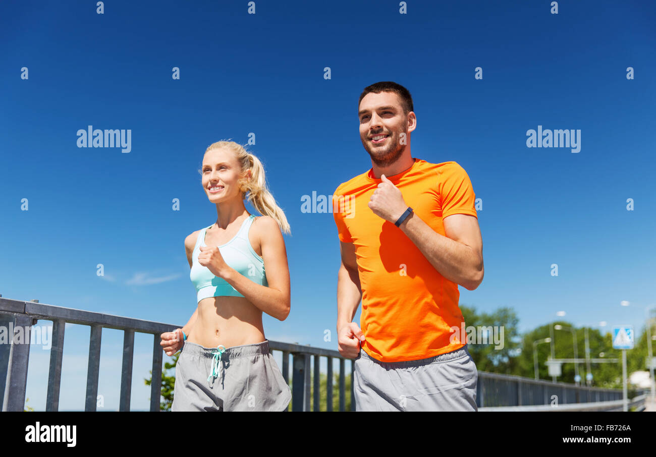 smiling couple running at summer seaside Stock Photo - Alamy