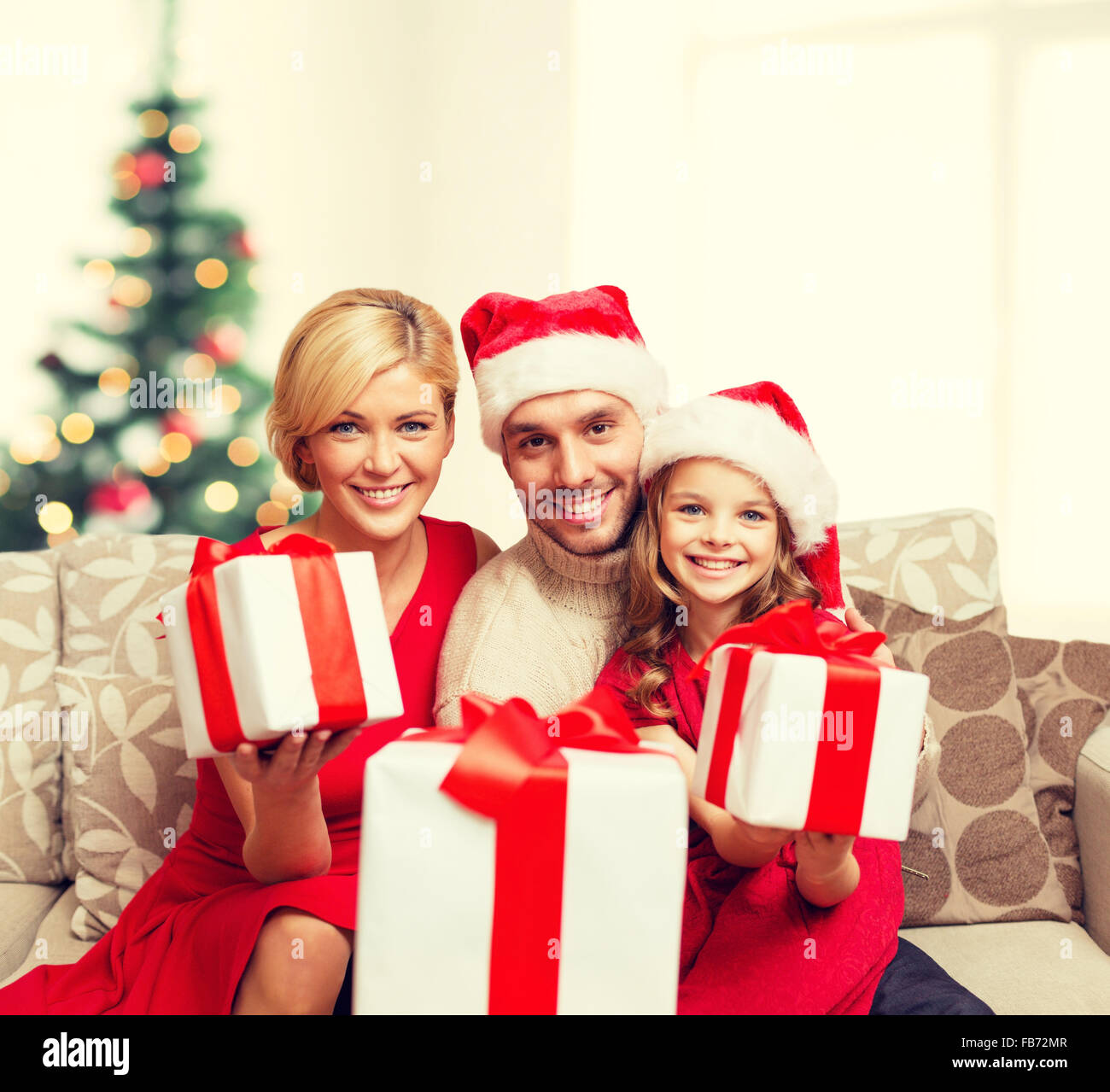 smiling family giving many gift boxes Stock Photo - Alamy