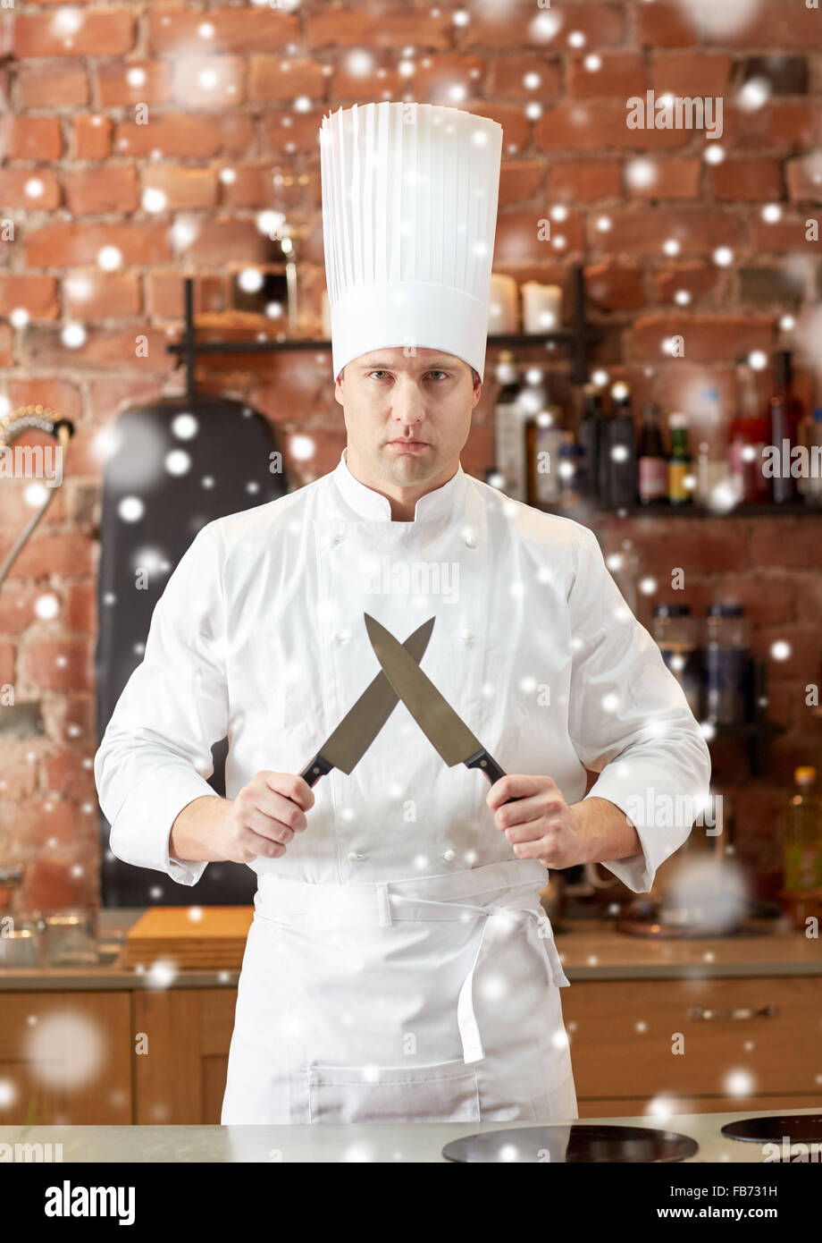 happy male chef cook in kitchen with knife Stock Photo - Alamy