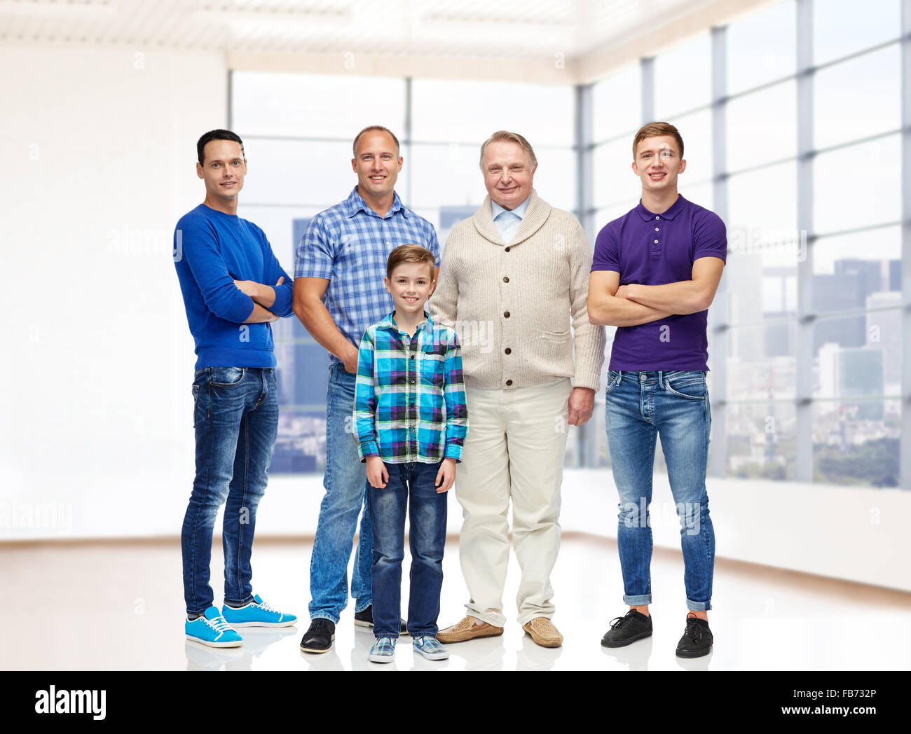 group of smiling men and boy Stock Photo - Alamy