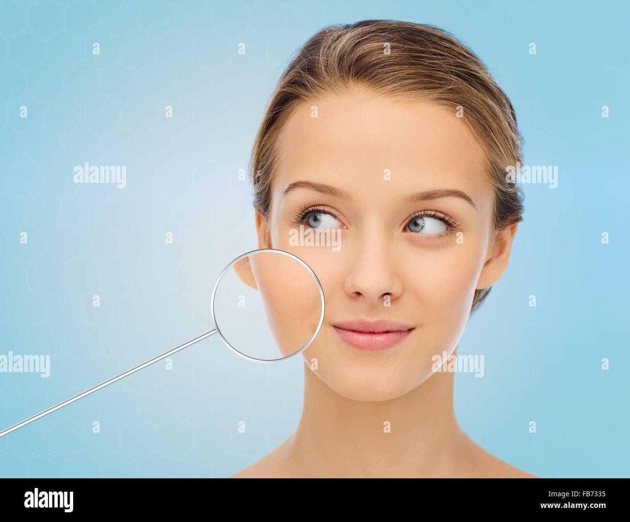 young woman face with magnifier showing good skin Stock Photo - Alamy