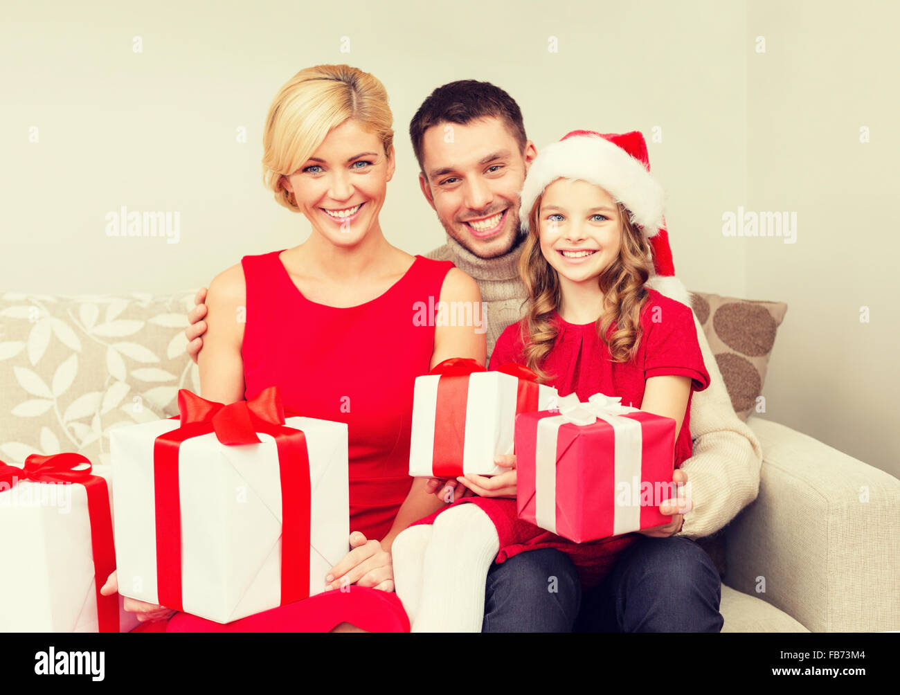 smiling family holding many gift boxes Stock Photo - Alamy