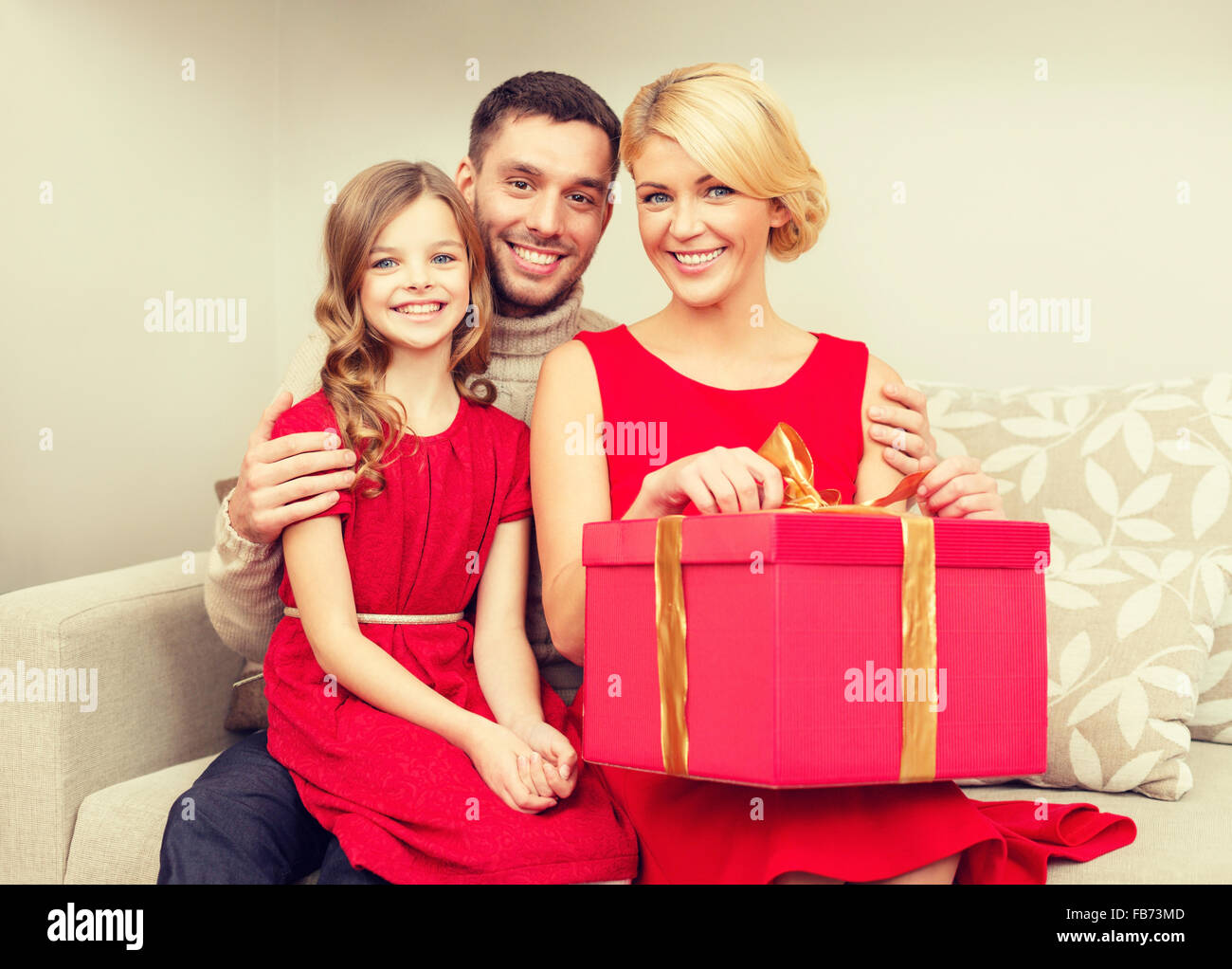 happy family opening gift box Stock Photo - Alamy