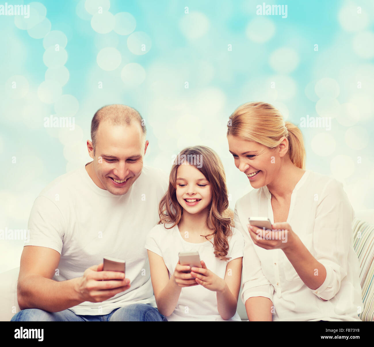 happy family with smartphones Stock Photo - Alamy