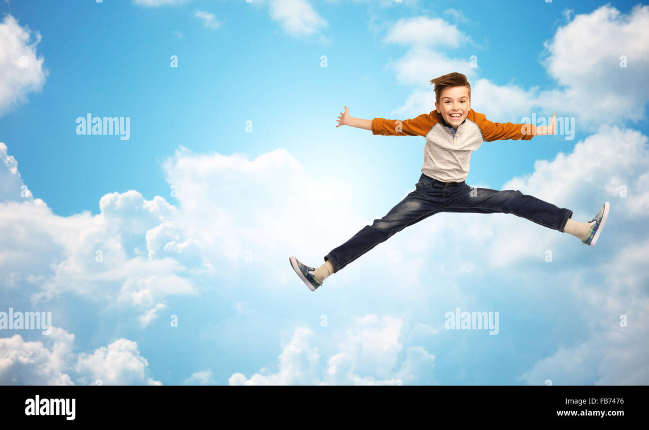 happy smiling boy jumping in air Stock Photo - Alamy