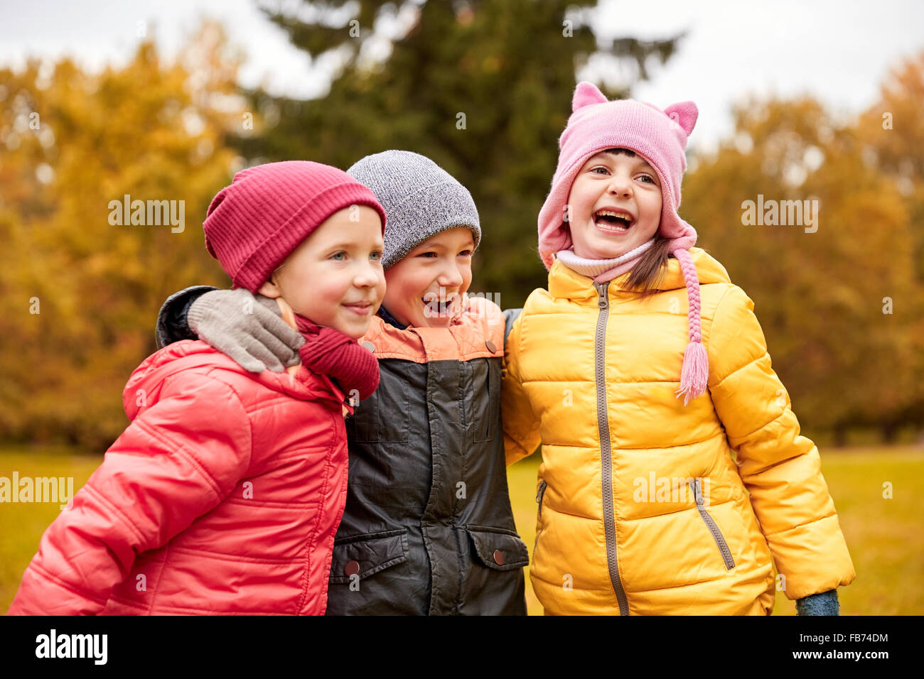 group of happy children hugging in autumn park Stock Photo - Alamy
