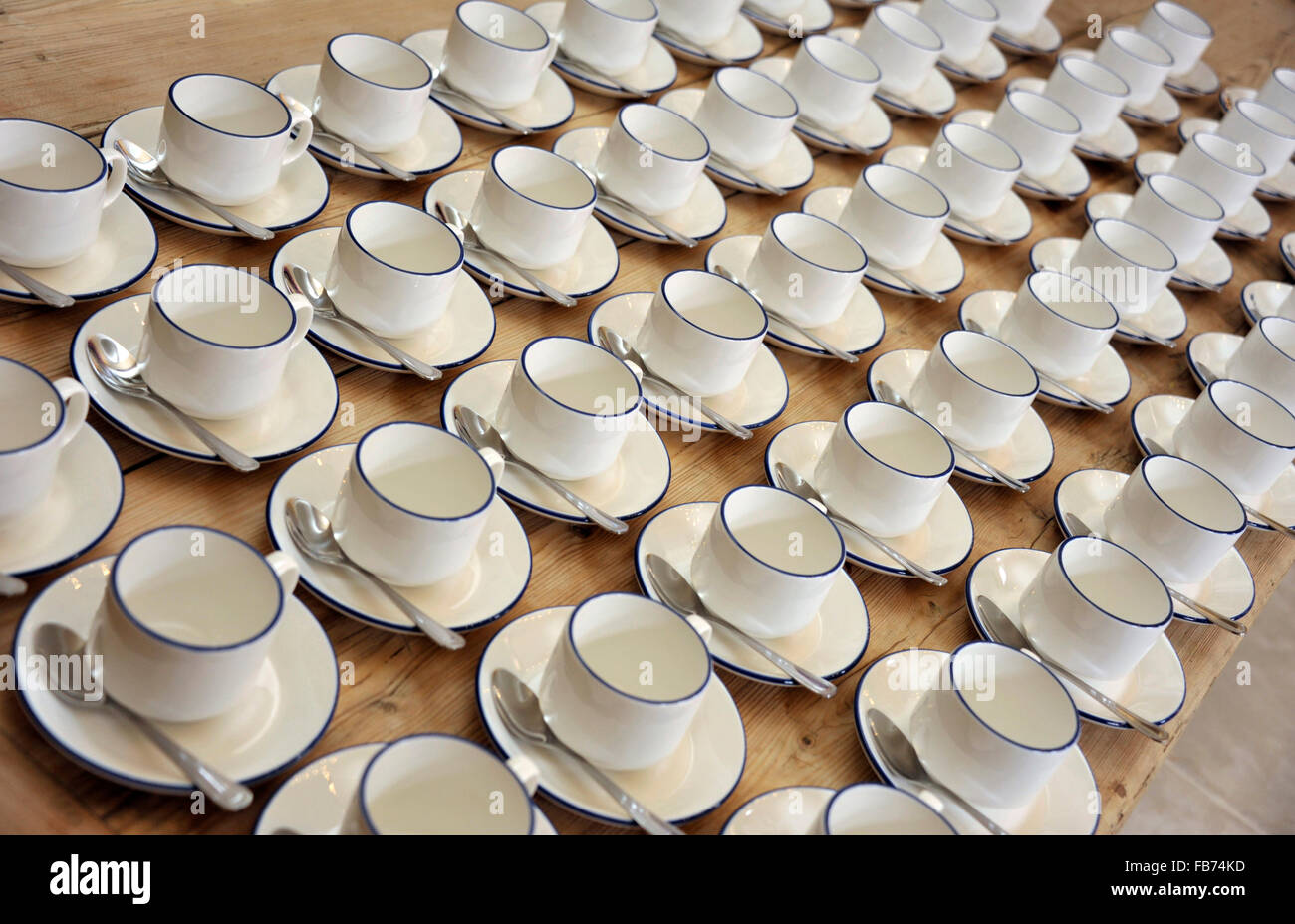 Table full of tea or coffee cups in line ready for a meeting ...