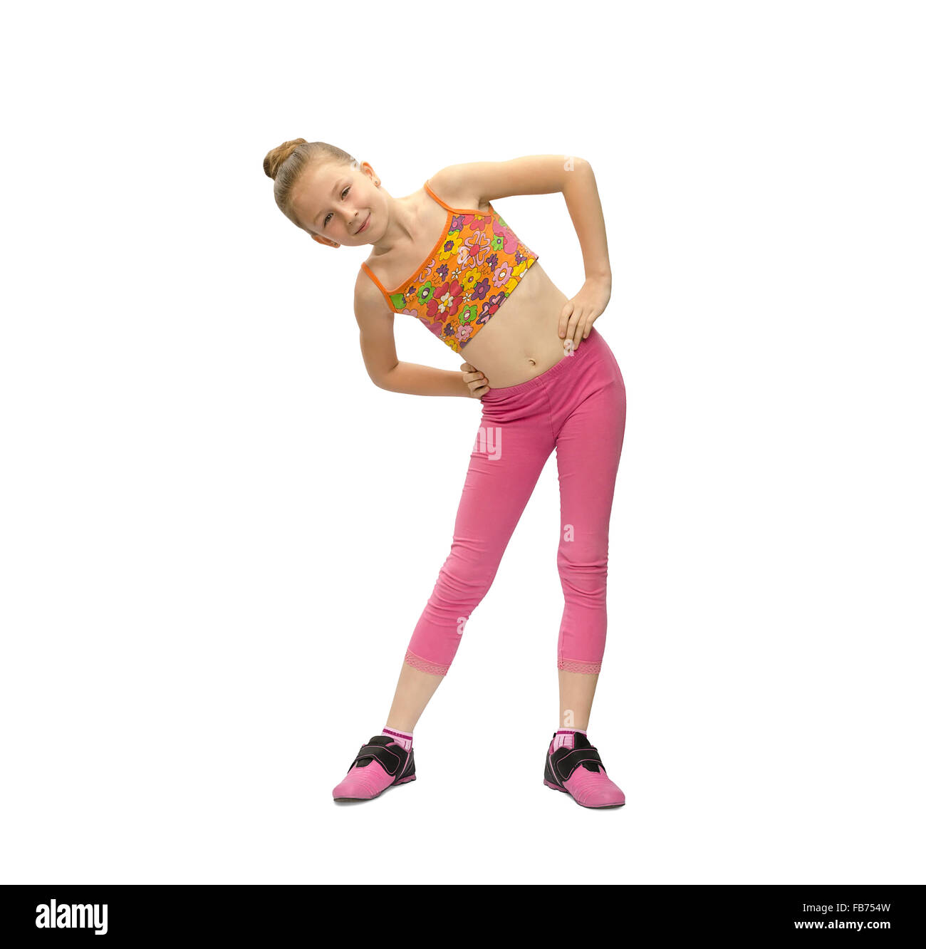 little girl does exercises on a white background Stock Photo - Alamy