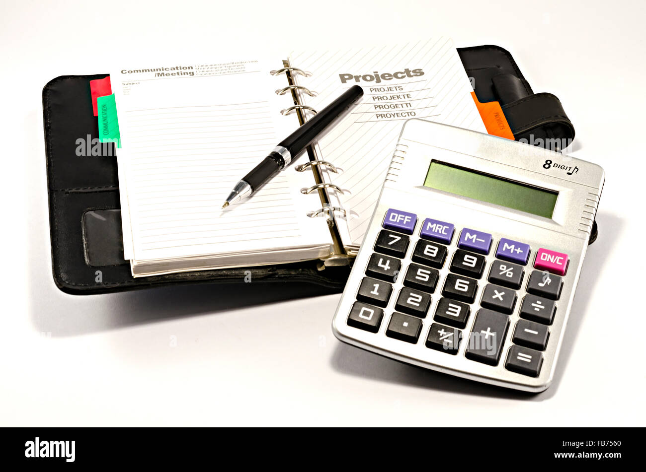 note pad with pen and calculator Stock Photo - Alamy
