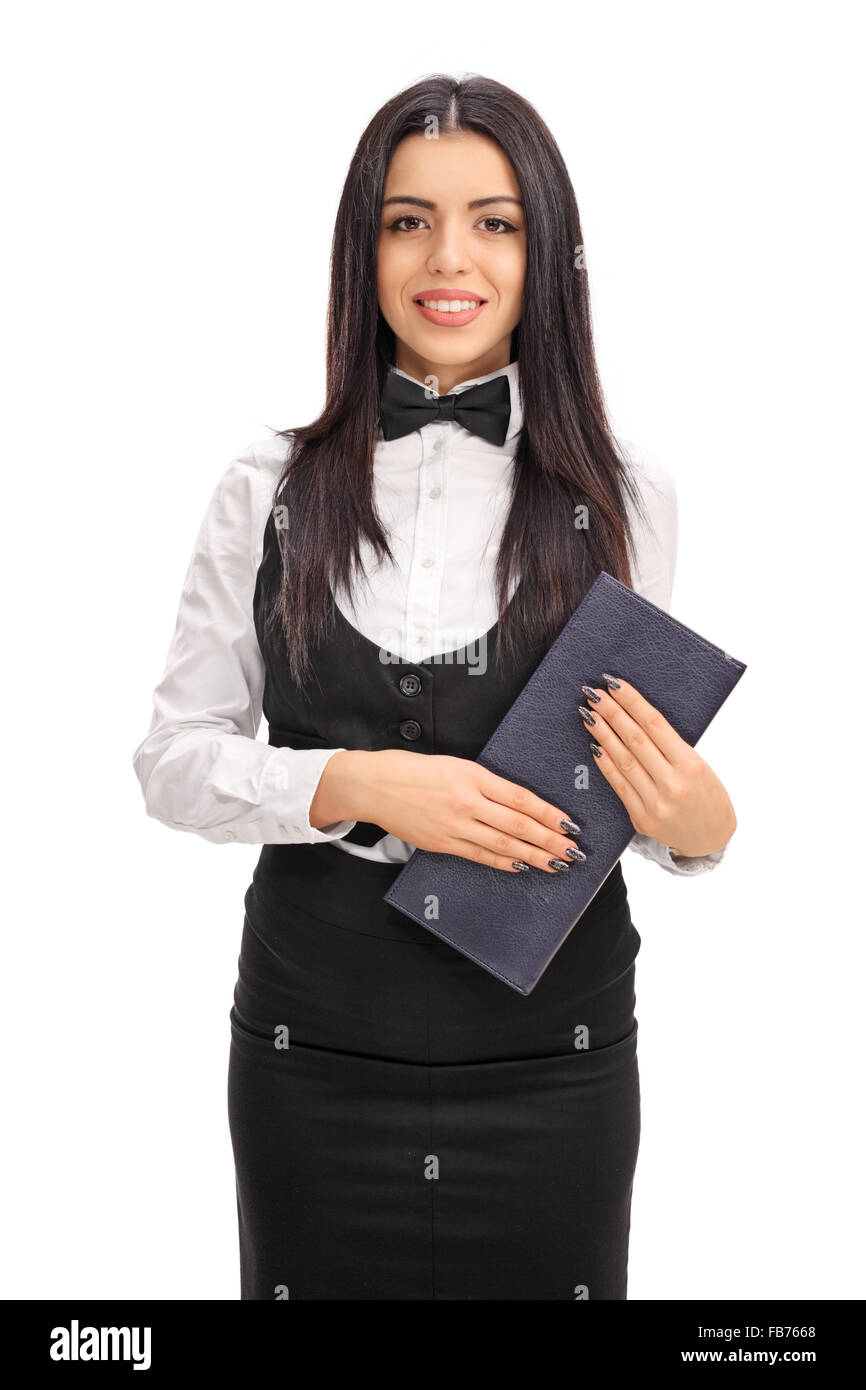 Vertical shot of a young waitress holding a menu and looking at the ...