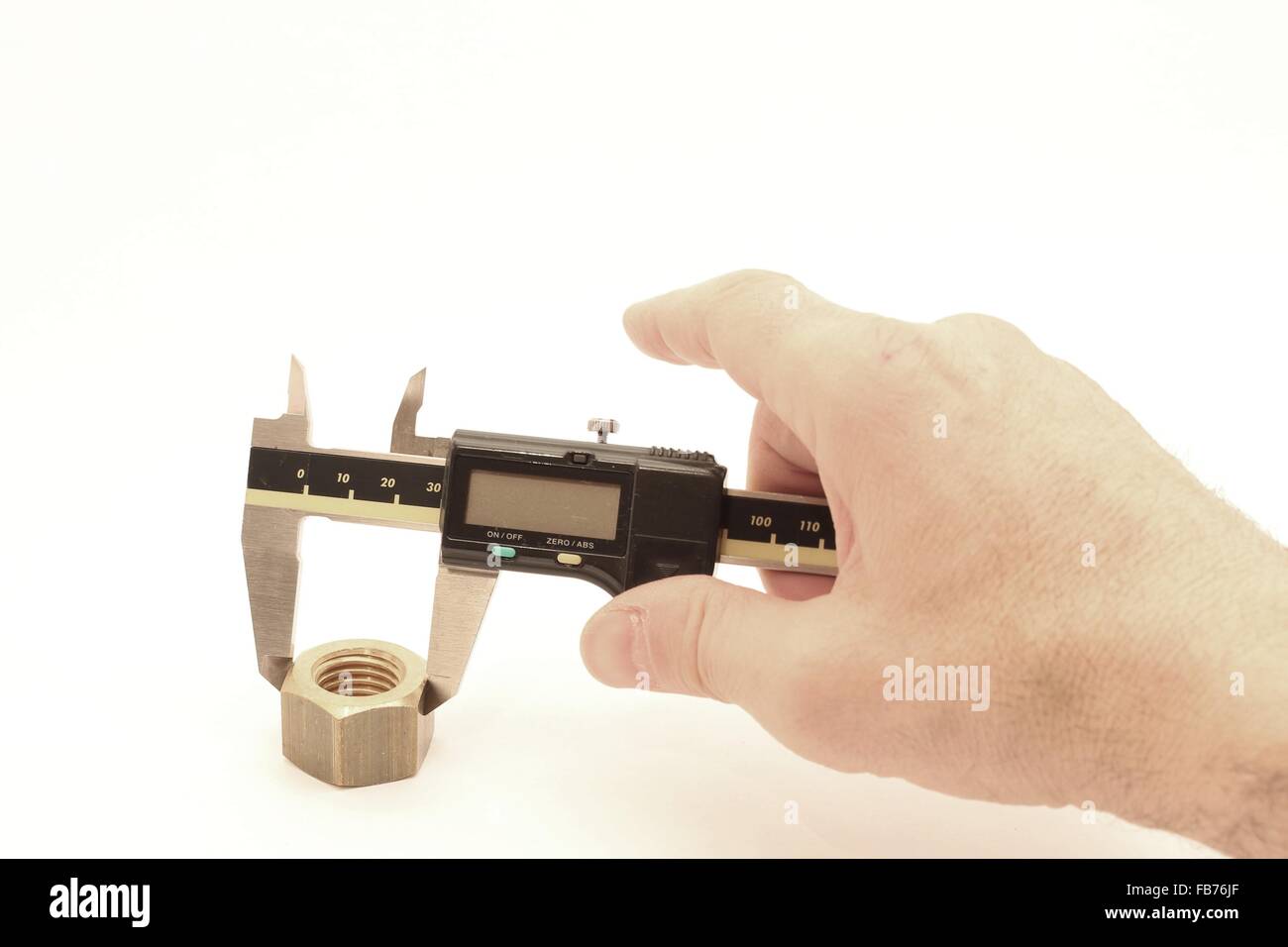 Measuring tools for machining process bolt of brass Stock Photo - Alamy