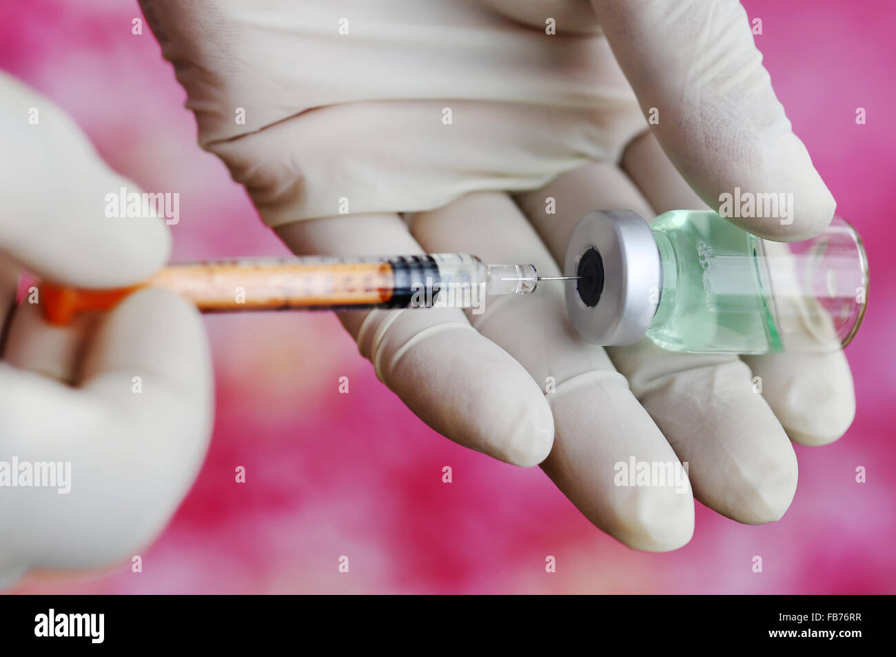 Glass syringe hand hi-res stock photography and images - Alamy