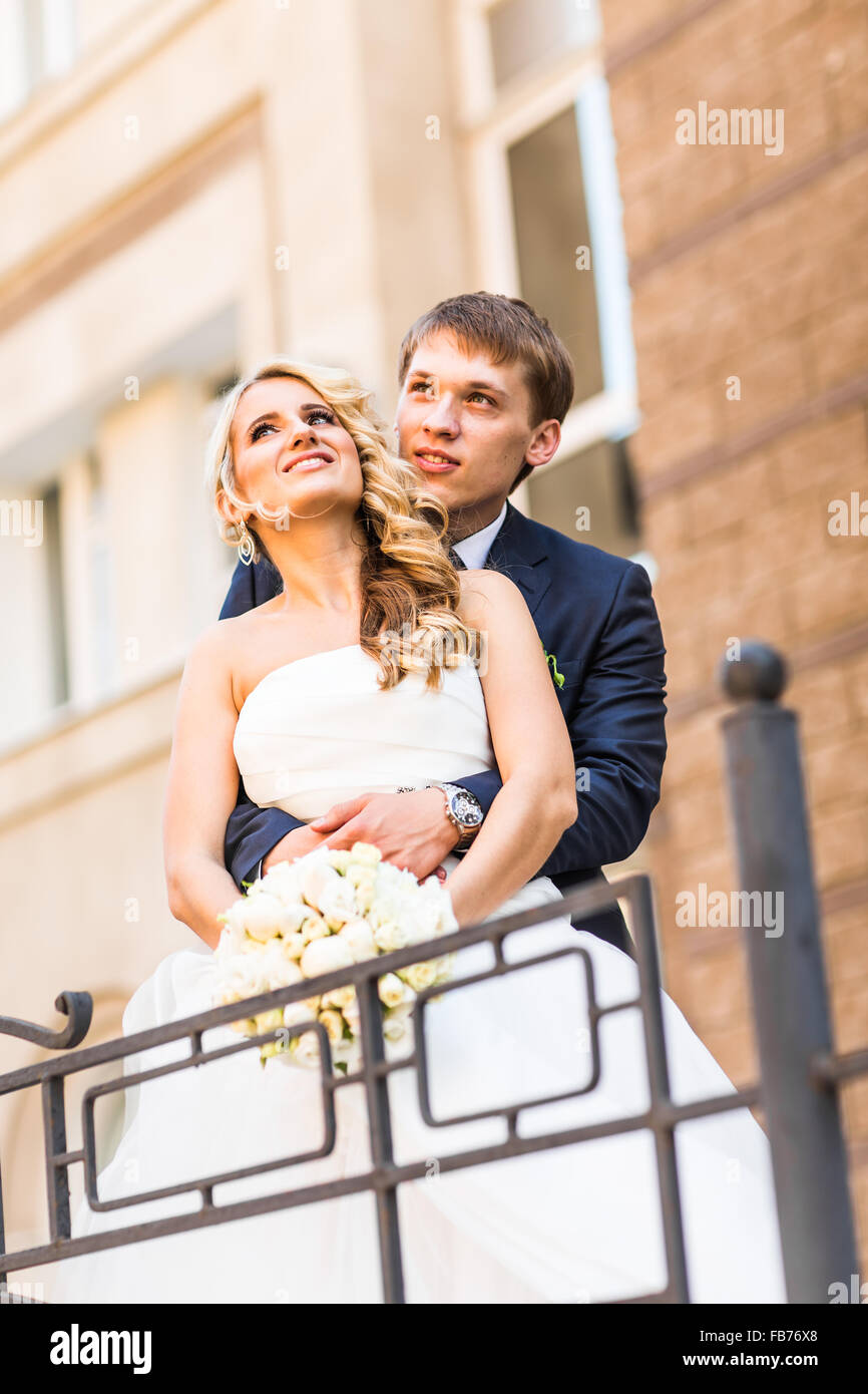 wedding couple hugging, groom embracing bride Stock Photo - Alamy