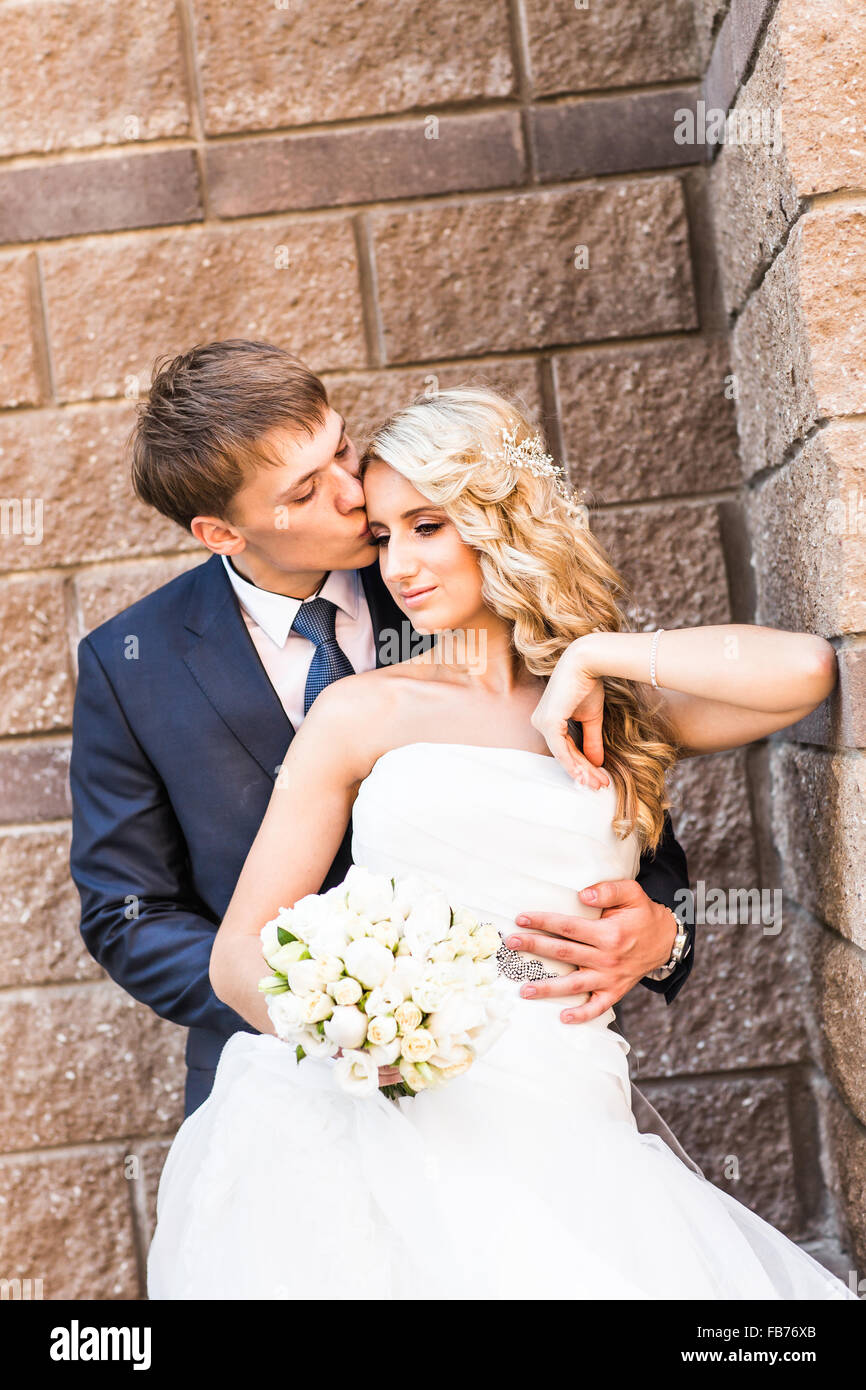wedding couple hugging, groom embracing bride Stock Photo - Alamy