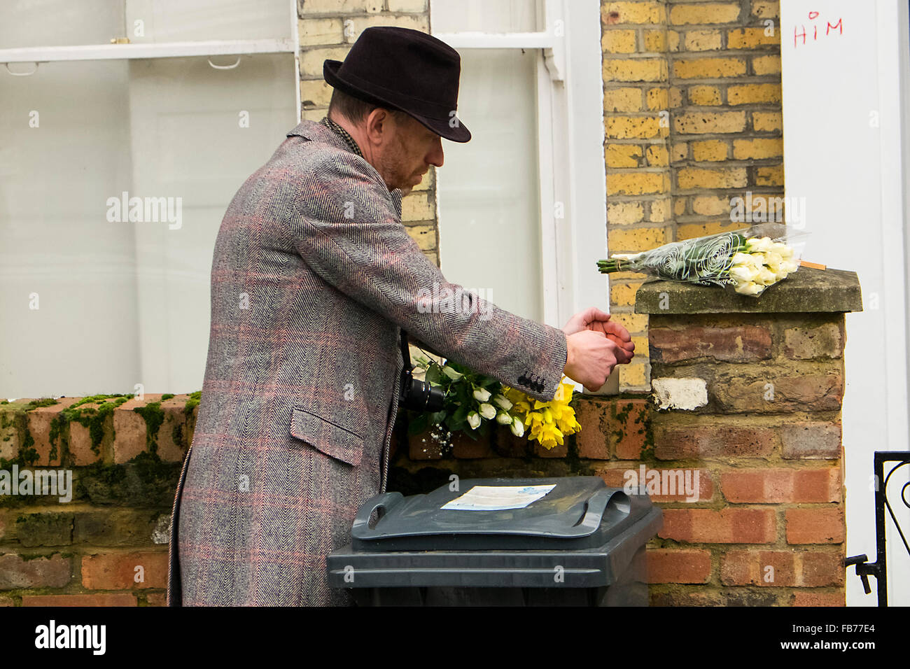 London, UK. 11th Jan, 2016. Tributes and flowers outside the home where ...
